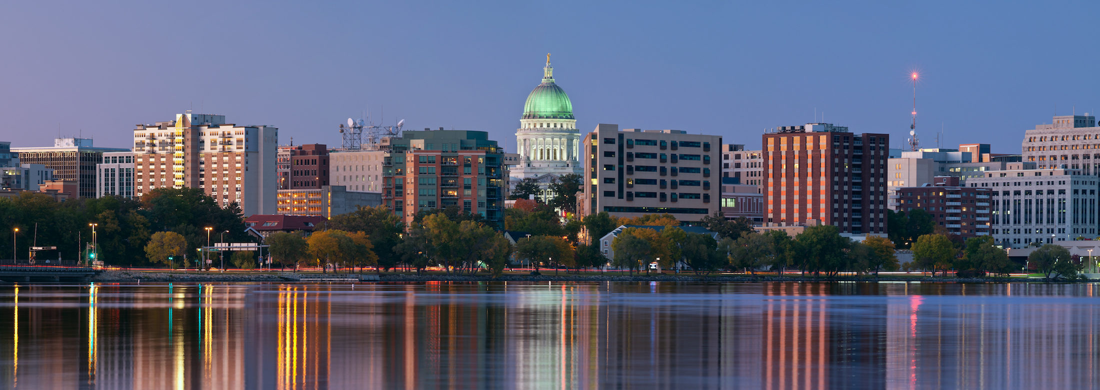 Scenery of Madison with a lake and tall office buildings - American ...